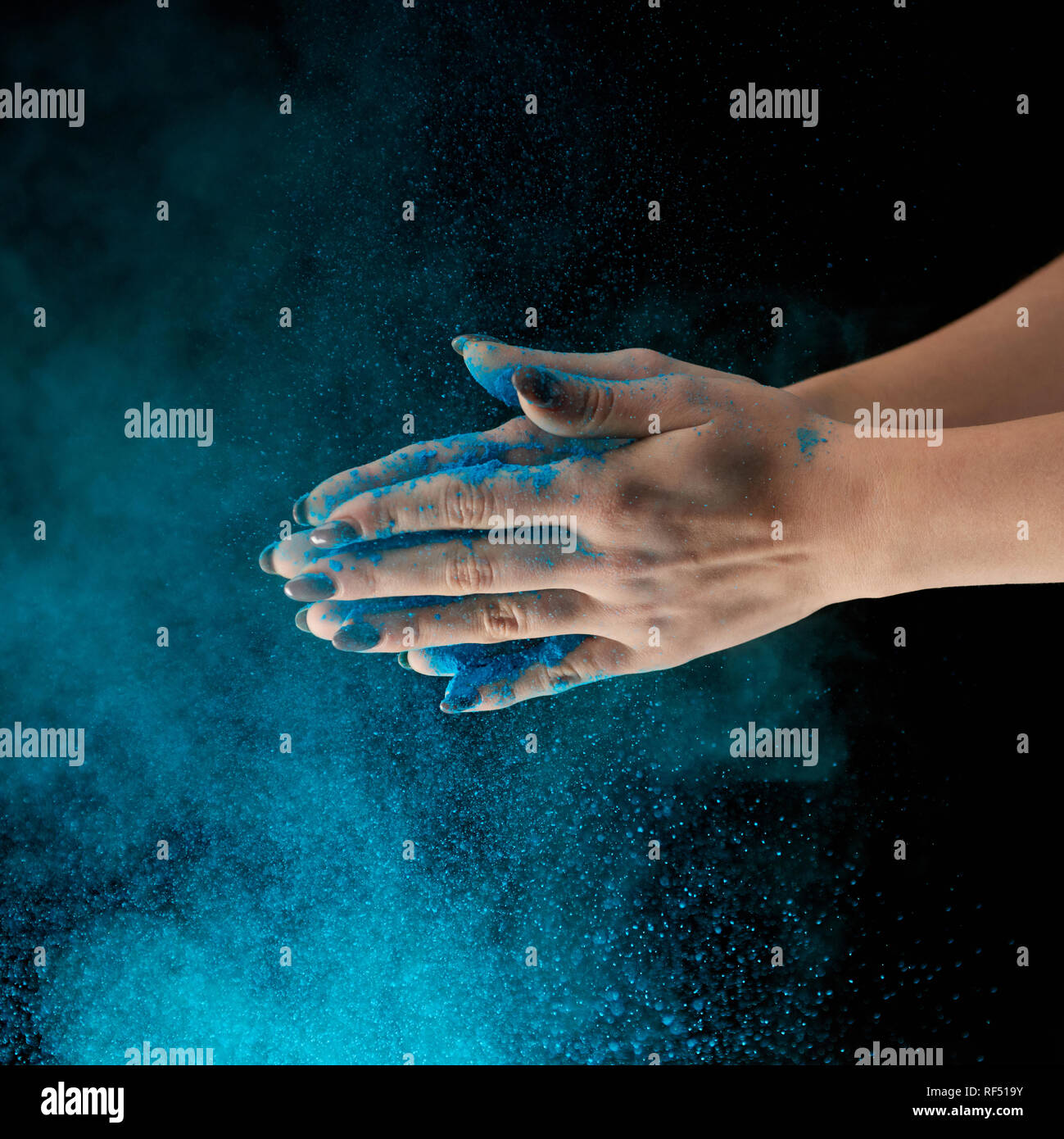 Hands clap blue paint hi-res stock photography and images - Alamy