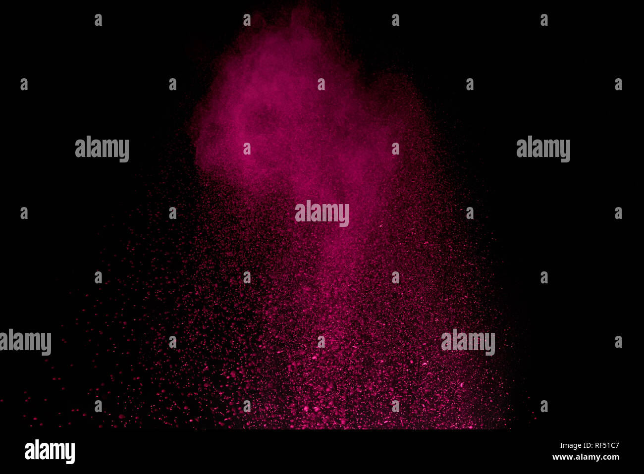 pink holi powder in air on black background Stock Photo - Alamy