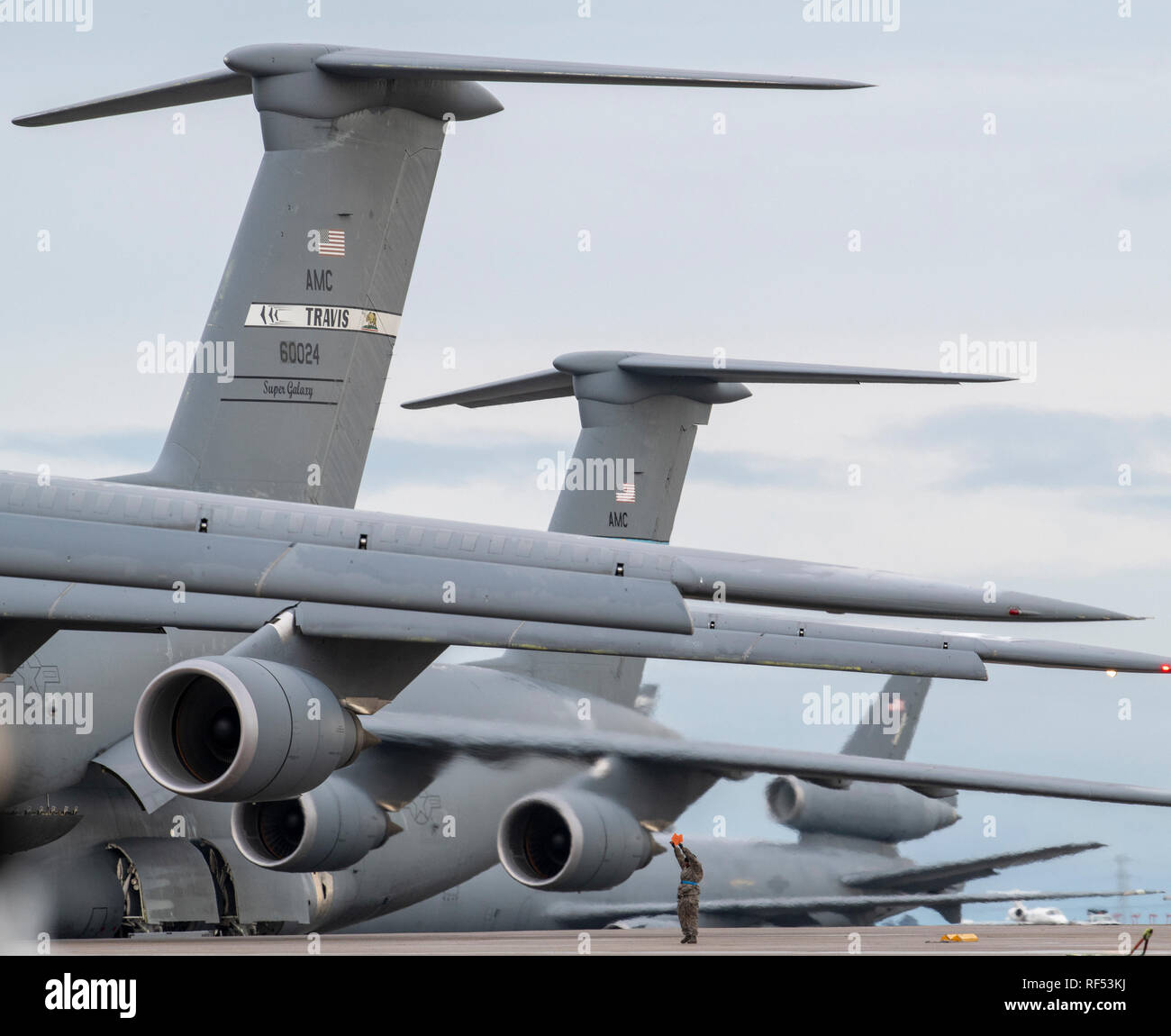 A U.S. Air Force C-5M Super Galaxy is marshalled into place, Jan 20 ...