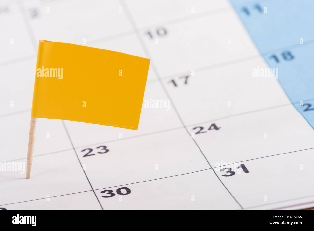 selective focus of yellow flag on number 22 in calendar Stock Photo - Alamy