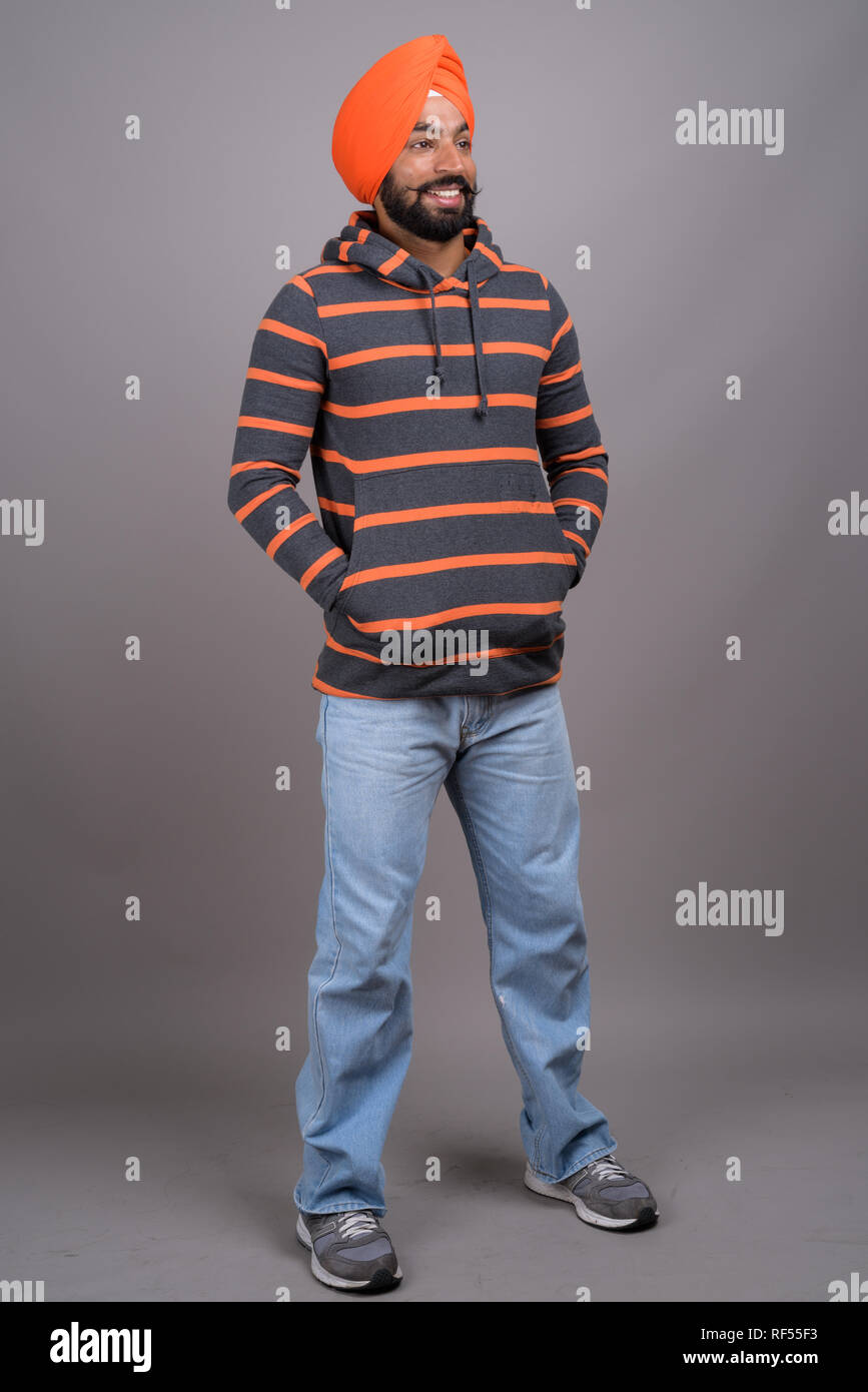 Full length shot of young handsome Indian Sikh man with turban Stock ...