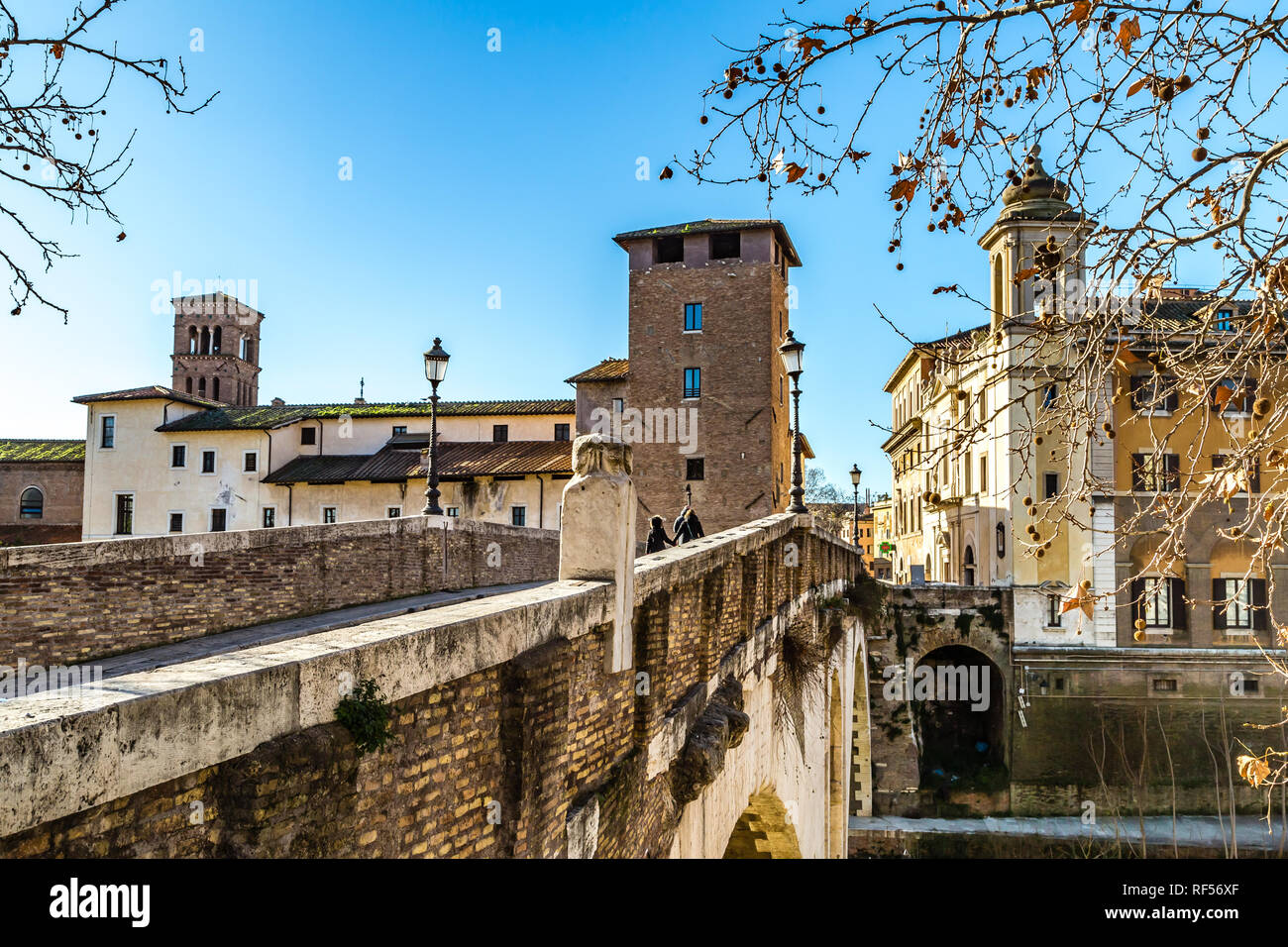 ROME, ITALY - JANUARY 4, 2019: tourists walking on Pons Fabricius, the ...