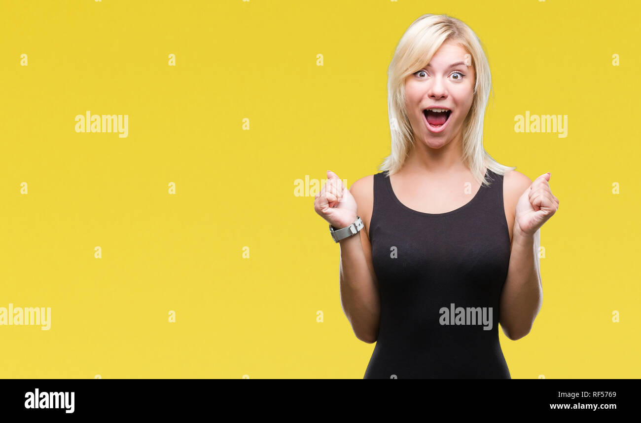 Young beautiful blonde attractive woman wearing elegant dress over ...