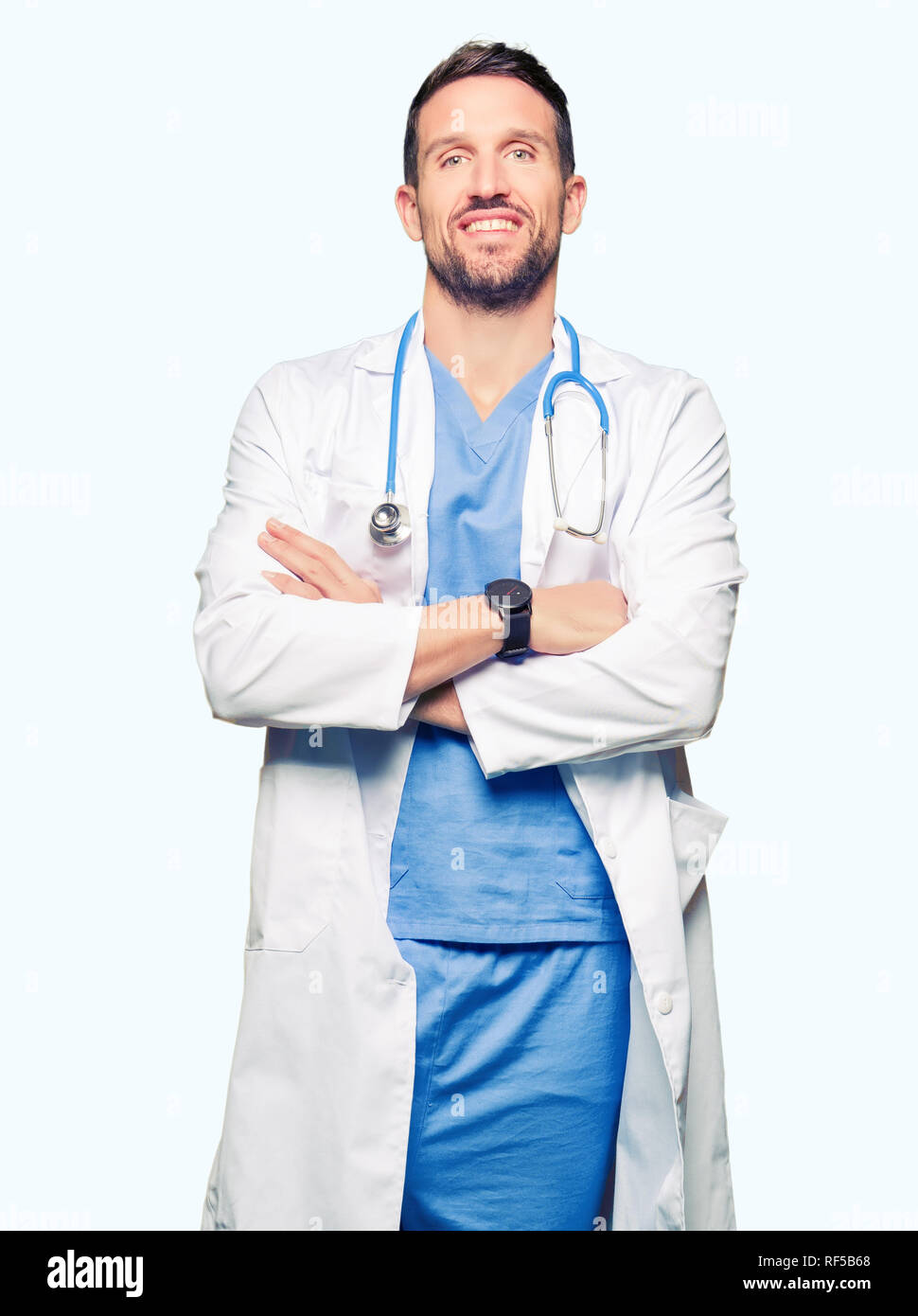 Handsome doctor man wearing medical uniform over isolated background ...