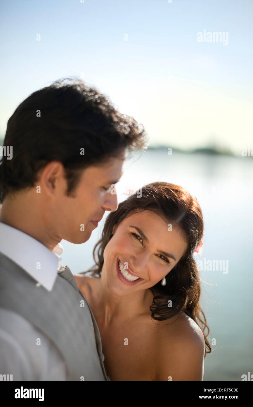Portrait of a smiling bride and her new husband Stock Photo - Alamy