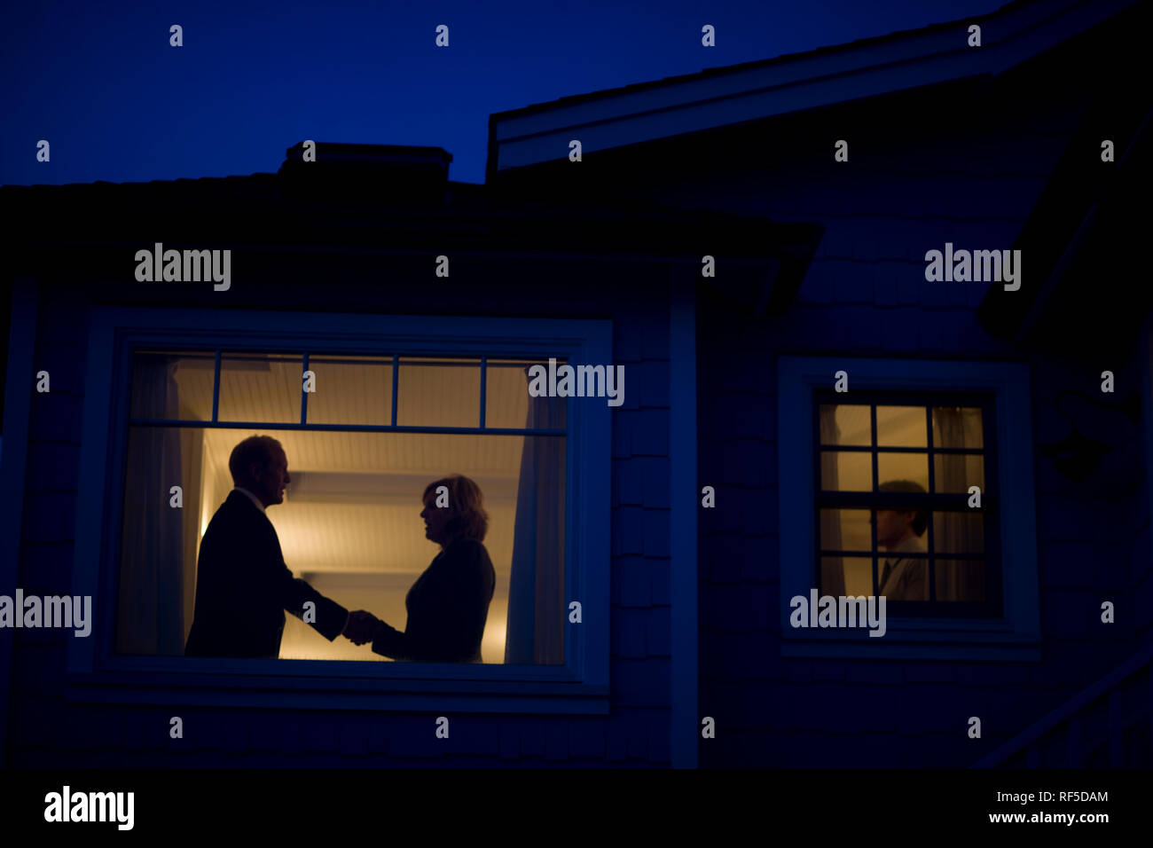 Man outside house night hi-res stock photography and images - Alamy