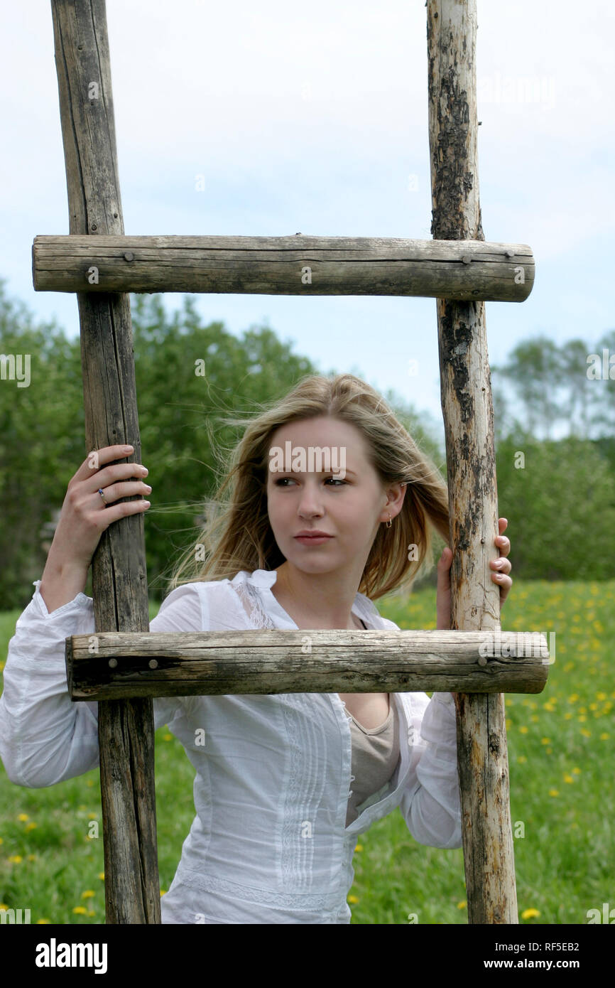 Pretty Caucasian blonde woman in a rural setting Stock Photo - Alamy