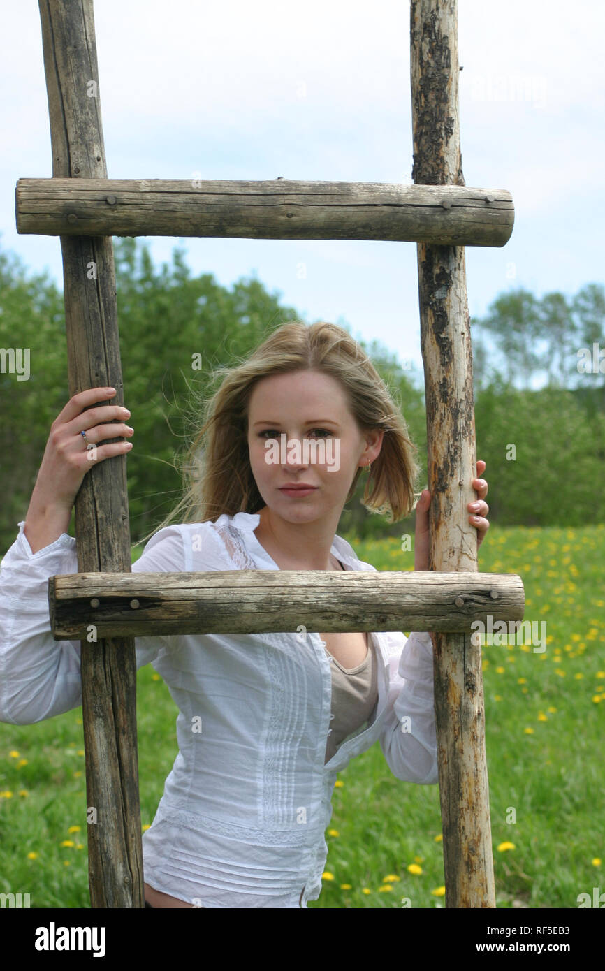 Pretty Caucasian blonde woman in a rural setting Stock Photo - Alamy
