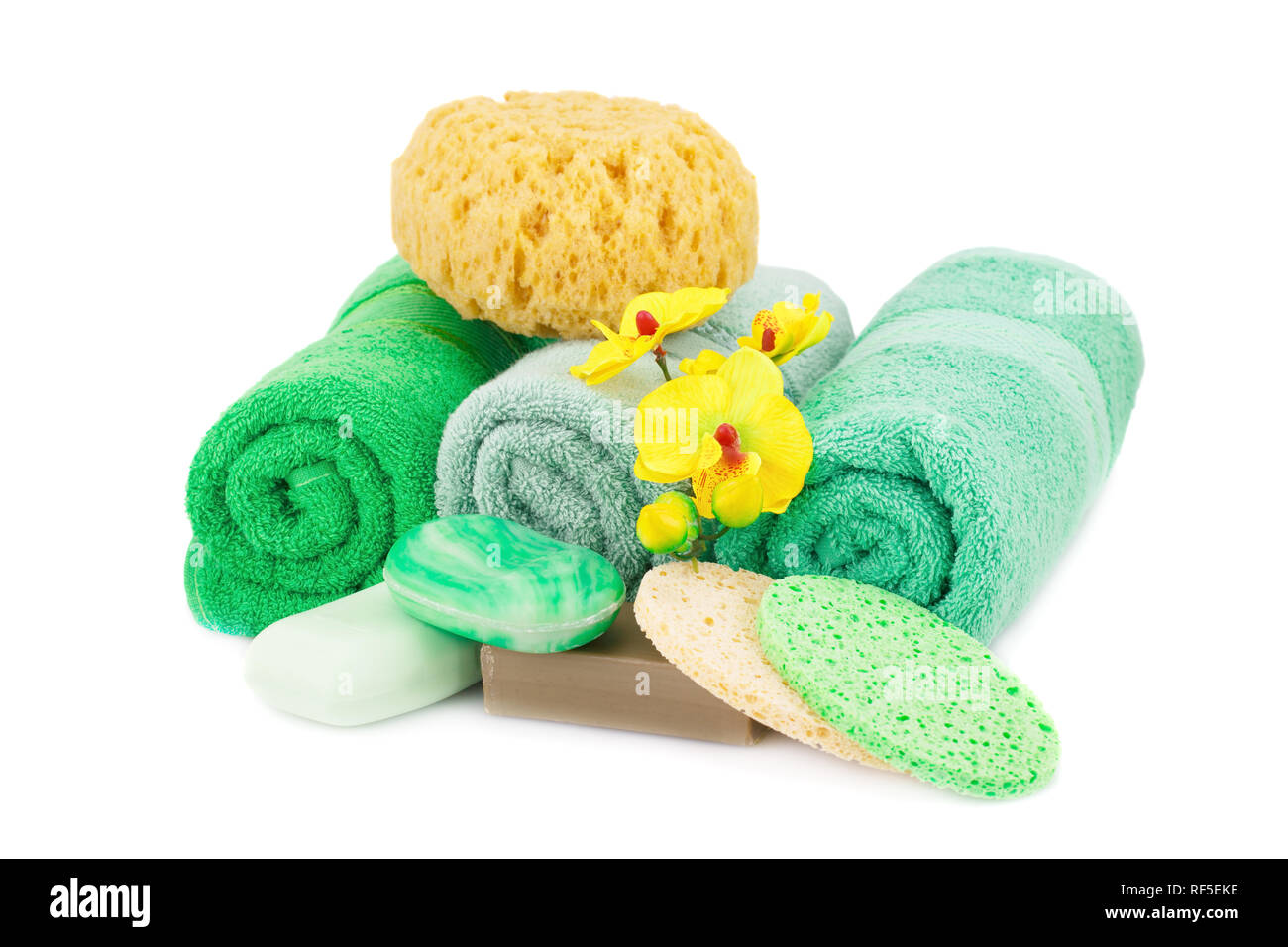 Spa set with towels, soaps, sponges and orchid flowers isolated on ...