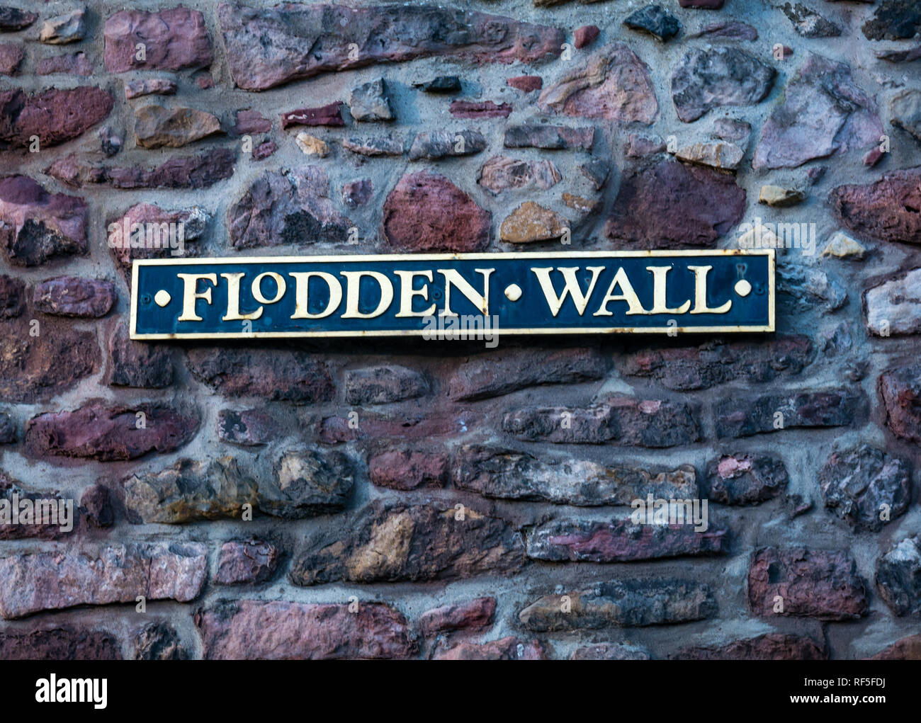 16th century Flodden Wall sign on old wall in vennel or alley off ...