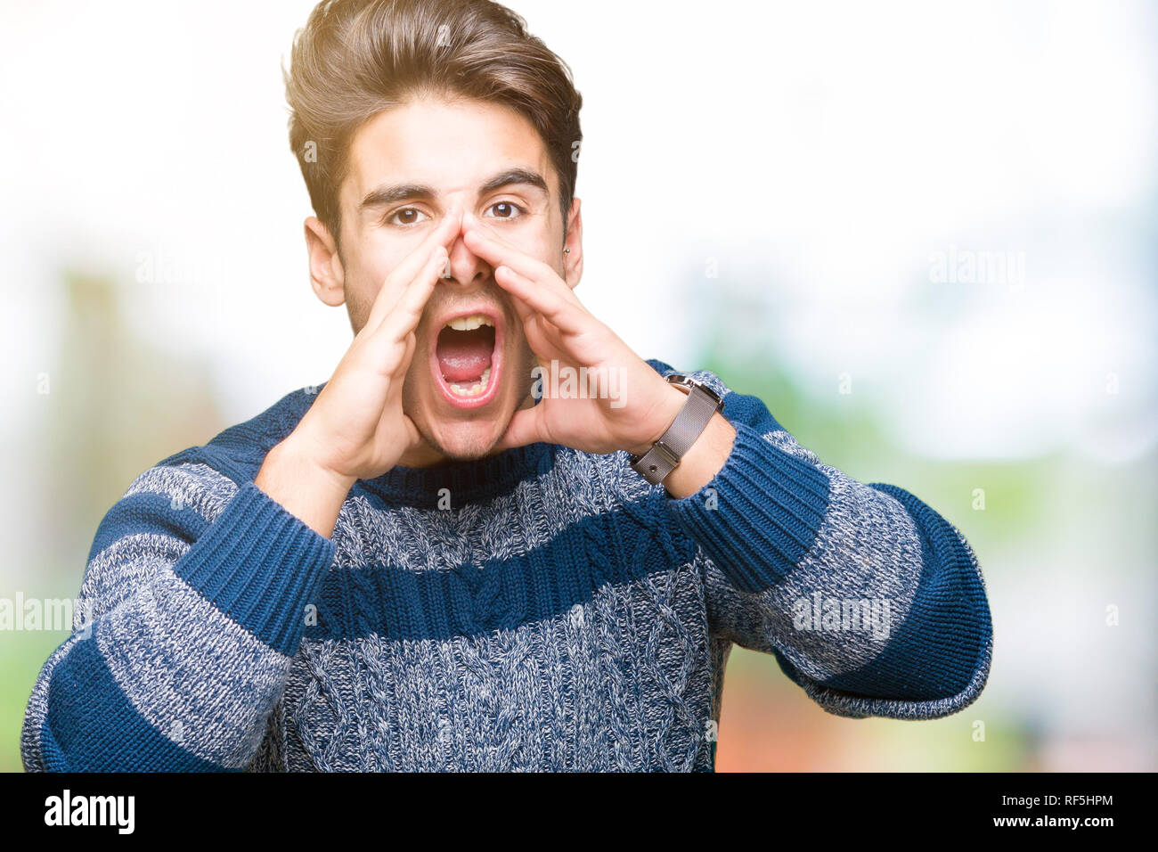 Young handsome man over isolated background Shouting angry out loud ...
