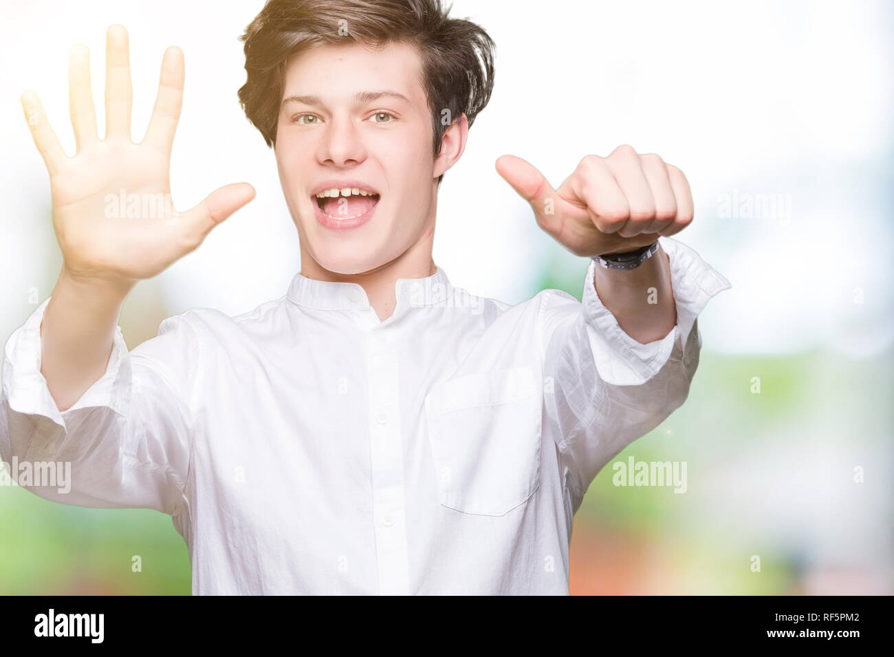 Young handsome business man over isolated background showing and ...