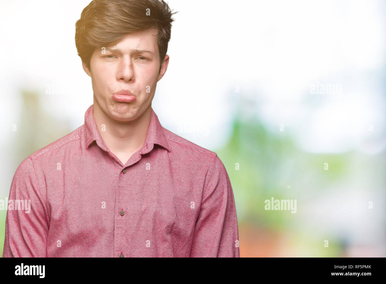Young handsome business man over isolated background depressed and ...