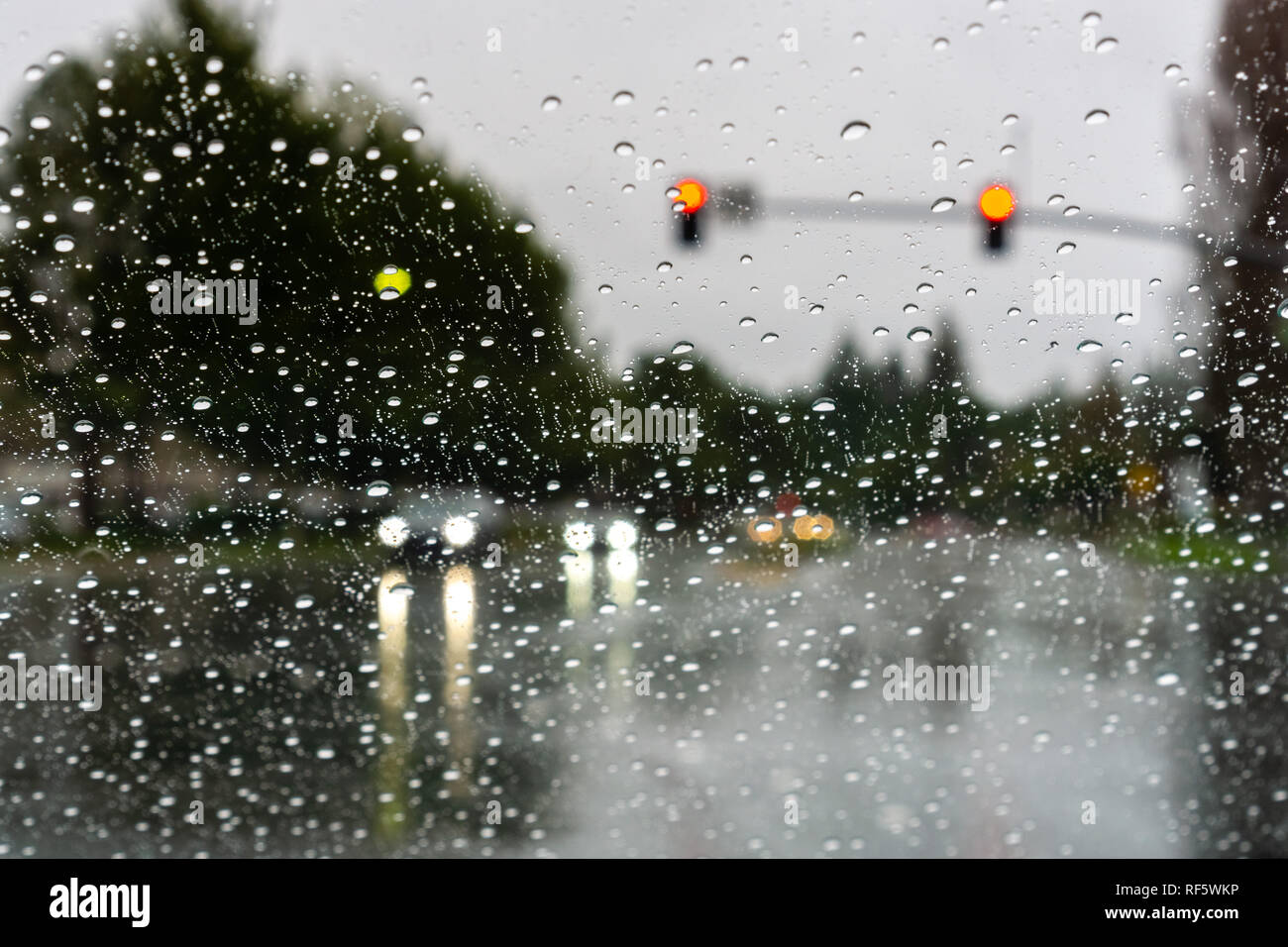 Cars driving through rain; raindrops on the windshield Stock Photo - Alamy