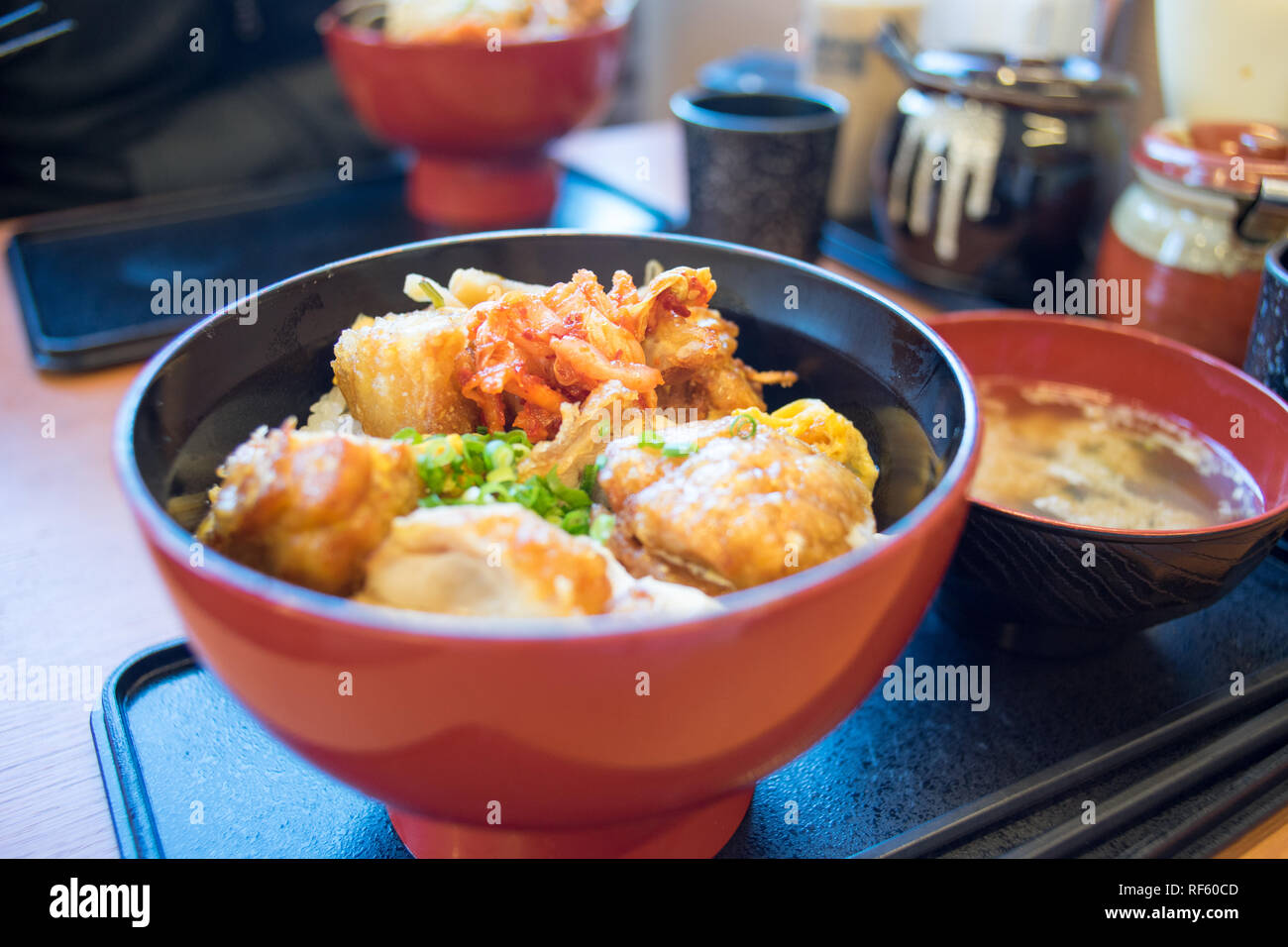 Fried chicken on the rice at a Japanese restaurant Stock Photo - Alamy