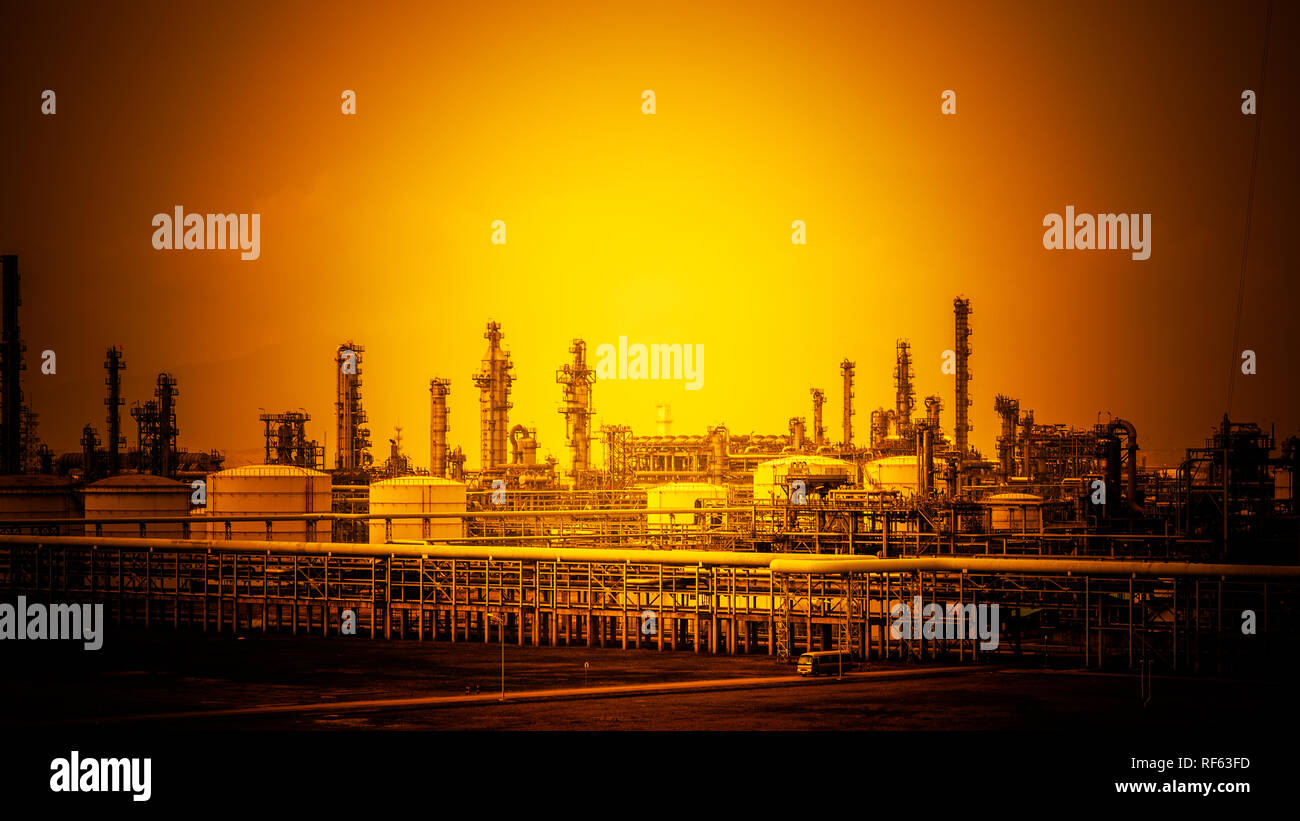 oil refinery with smoke stacks in sunset Stock Photo - Alamy