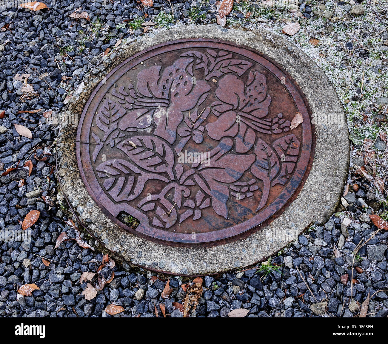 Takayama, Japan - Dec 30, 2015. Manhole drain cover on the street in ...