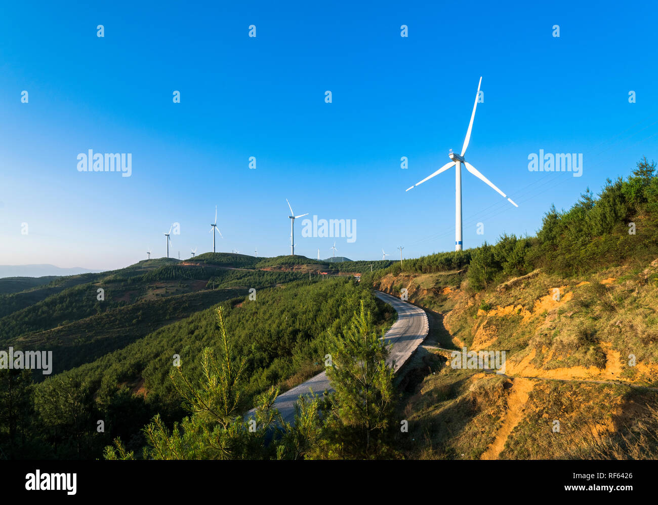 wind turbine on the top of mountain yunnan china Stock Photo - Alamy