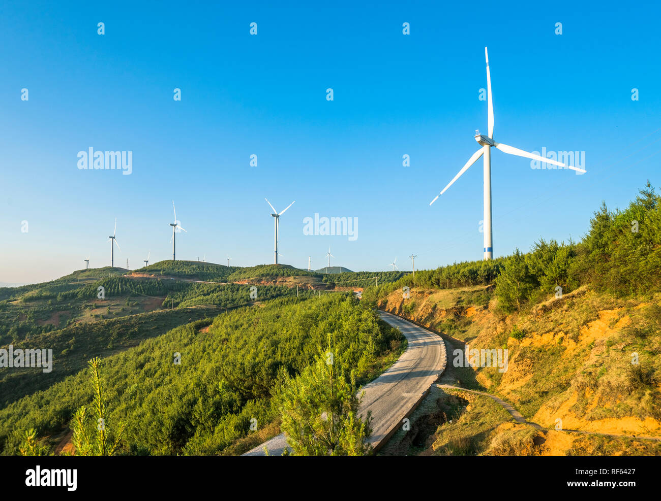 wind turbine on the top of mountain yunnan china Stock Photo - Alamy