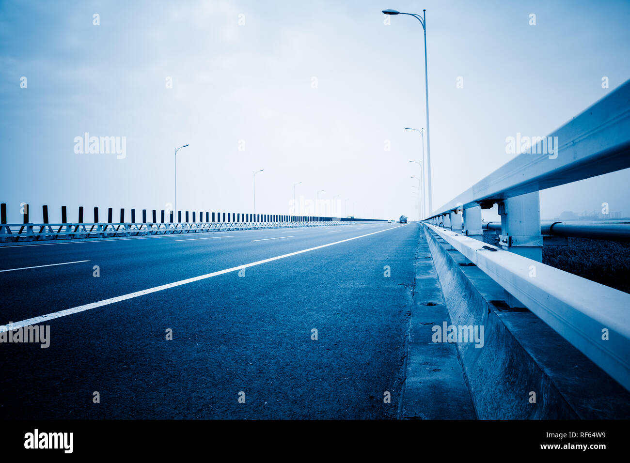 empty highway, blue toned images Stock Photo - Alamy