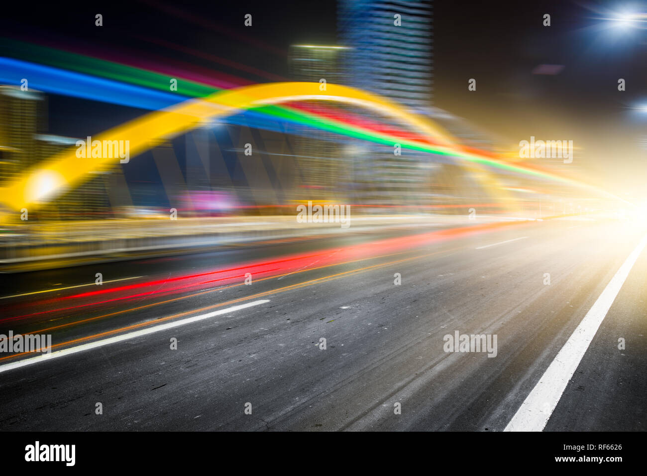 speeding lights of cars in city at night Stock Photo - Alamy
