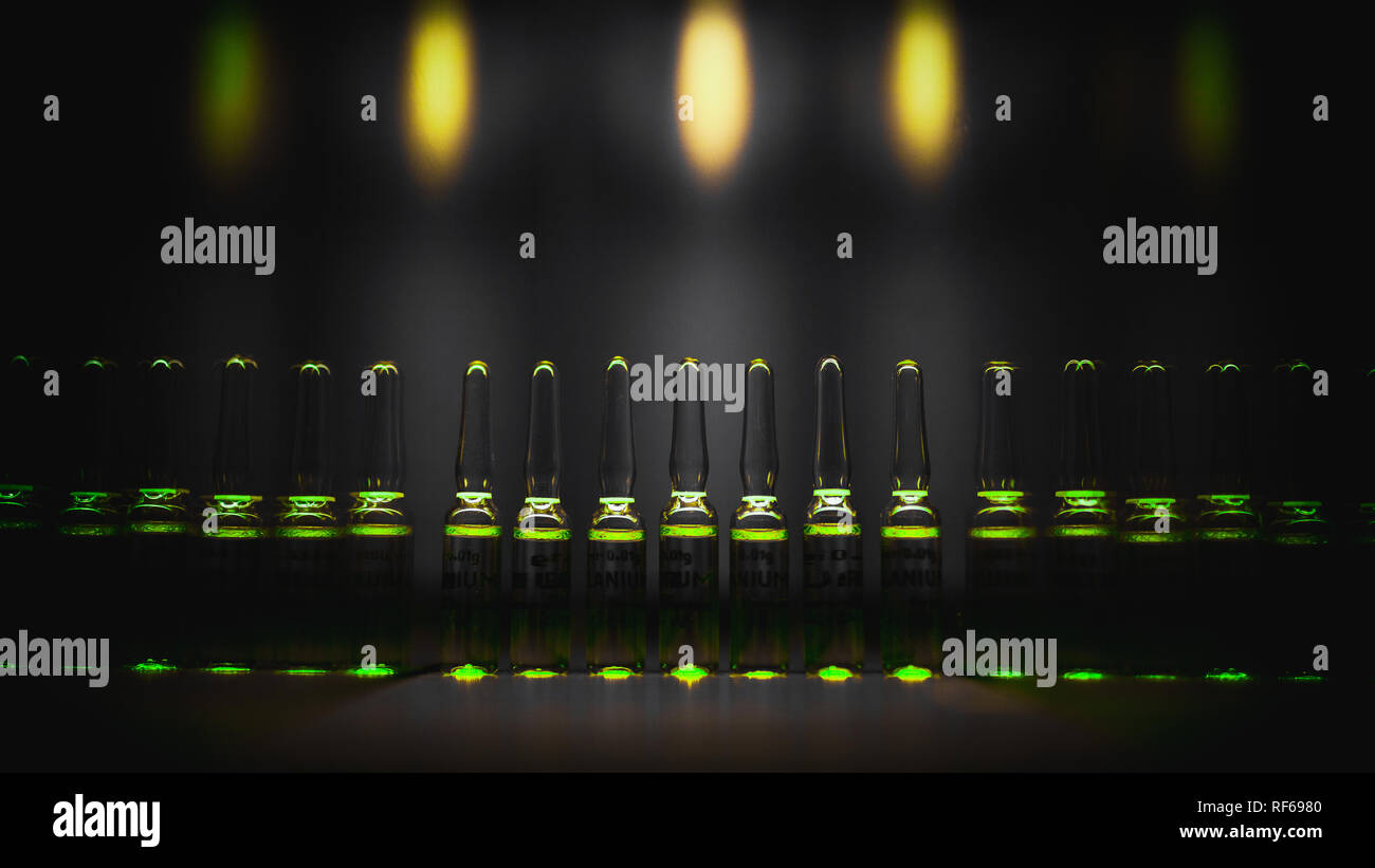 Medical vials for injection isolated on a dark background. Ampoules ...