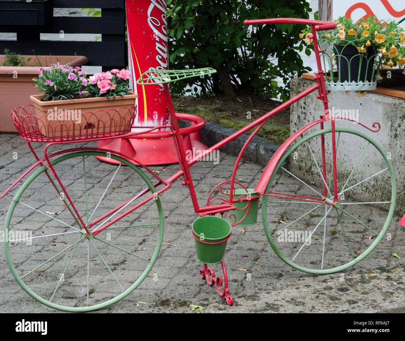 A restaurant along the Danube River cycle Path displays a planter in the shape of a bike Stock ...