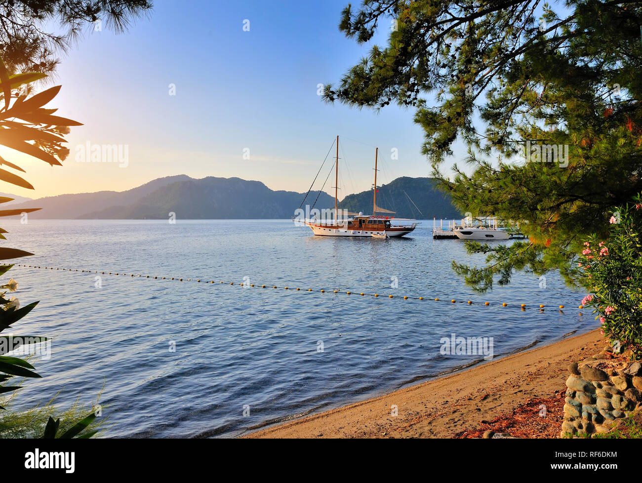 Calm bay with clear water and anchored sail boat. Turkey Stock Photo ...