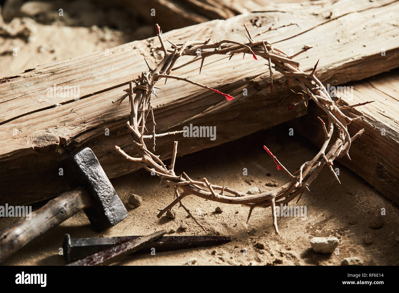Crown of thorns among cross, hammer with nails as crucifixion symbols ...