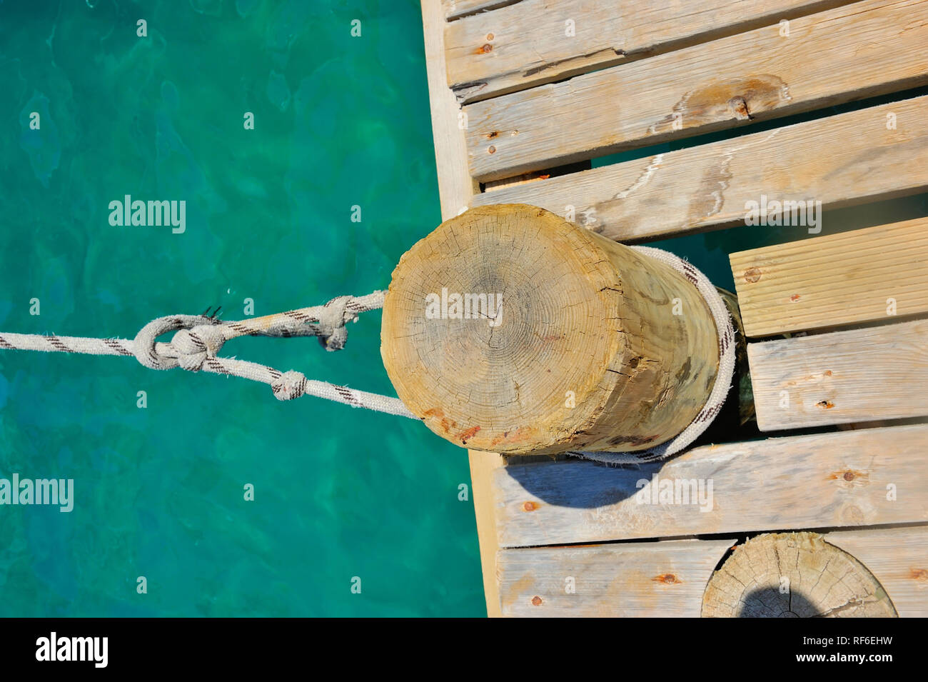 Old rope tied wooden pole hi-res stock photography and images - Alamy