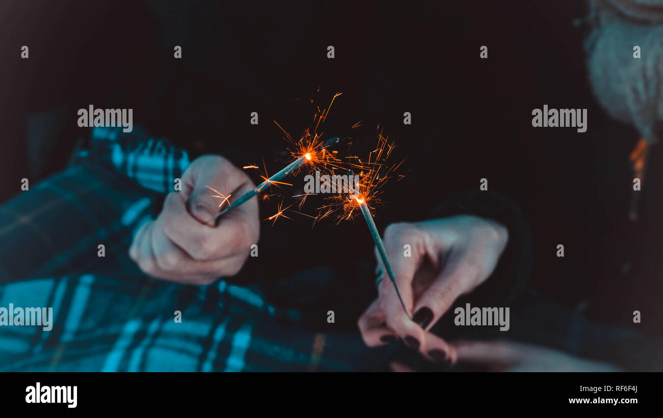 Bengal fire sticks, sparkling, burning, lovers hands fire Stock Photo ...