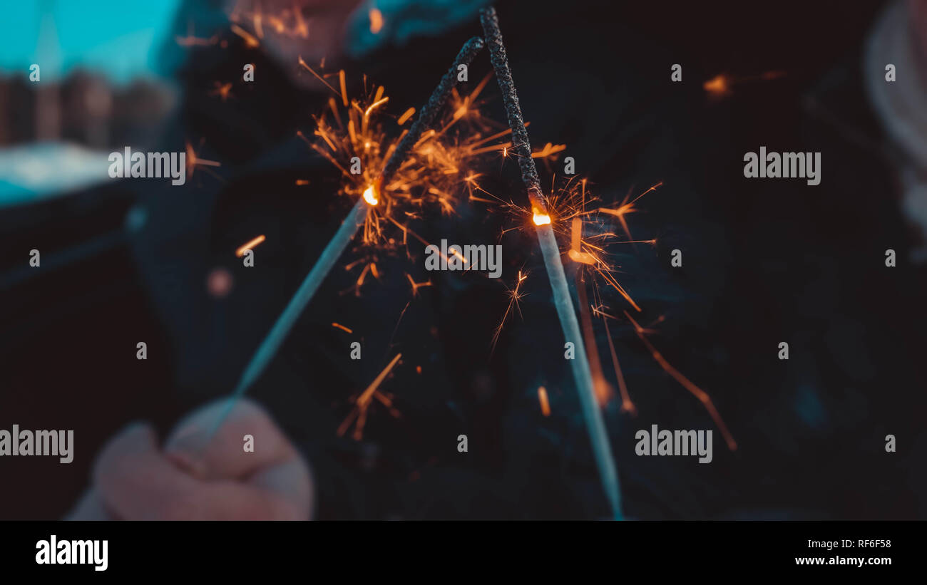 Bengal fire sticks, sparkling, burning, lovers hands fire Stock Photo ...