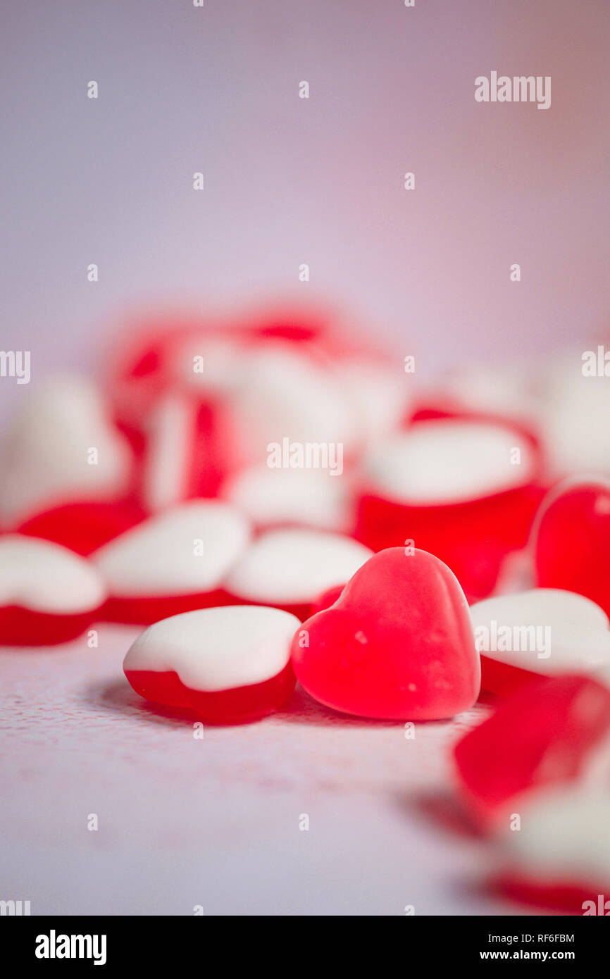 Haribo hearts on a pink background Stock Photo - Alamy