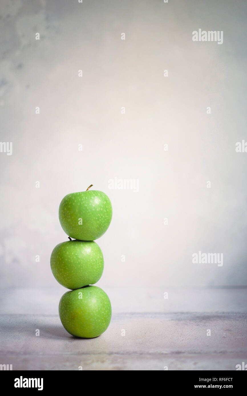 Three apples stacked on top of each other Stock Photo - Alamy