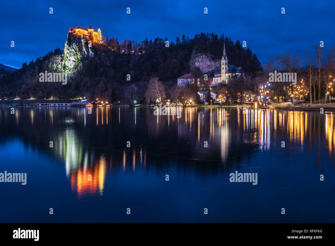 Lake Bled. Atmosphere of Christmas. Lights and reflections at night ...
