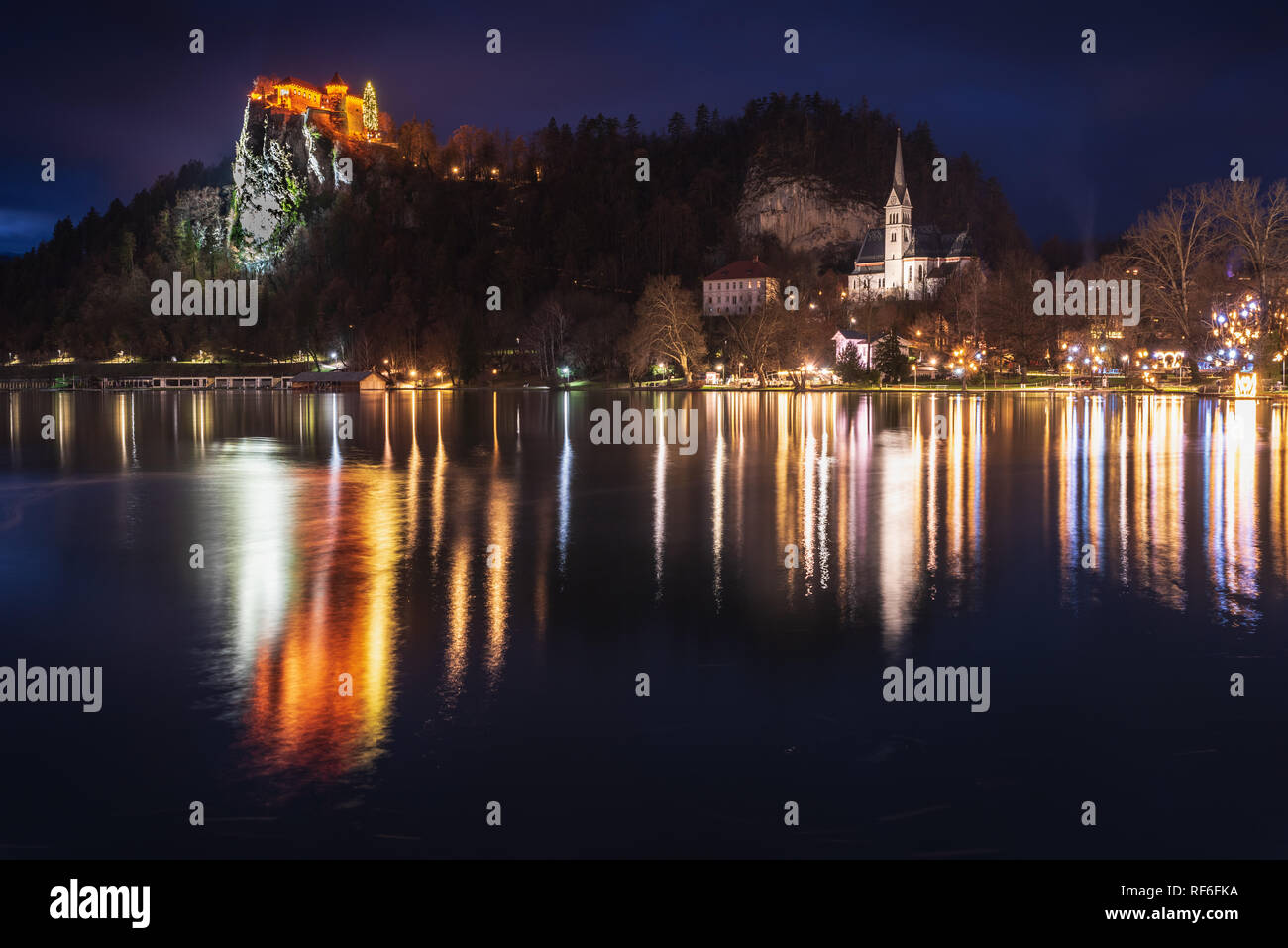 Lake Bled. Atmosphere of Christmas. Lights and reflections at night ...