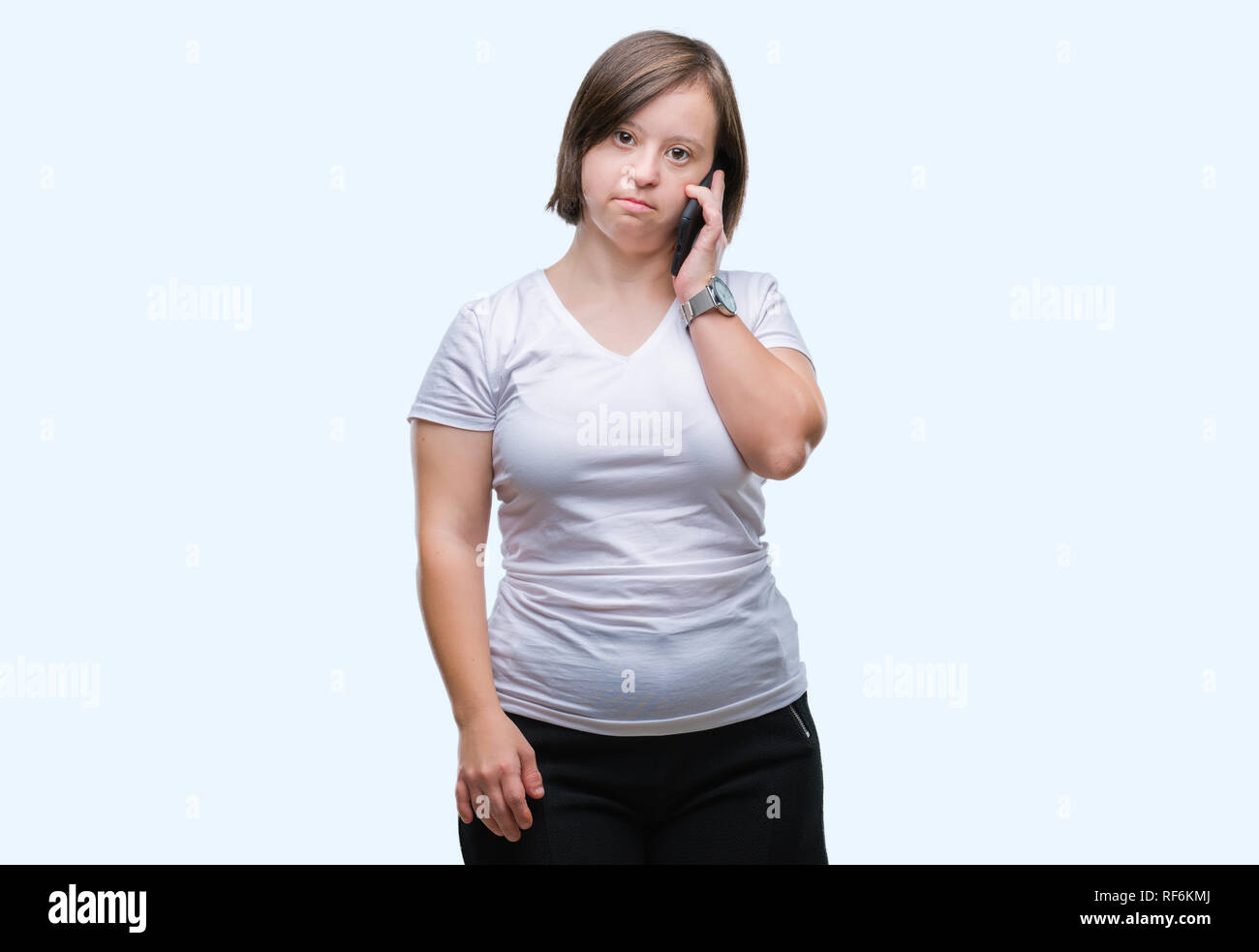 Young adult woman with down syndrome taking using smartphone over ...