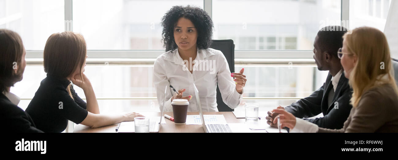 Horizontal photo african female boss talking at corporate meeting Stock ... Horizontal photo african female boss talking at corporate meeting Stock ...