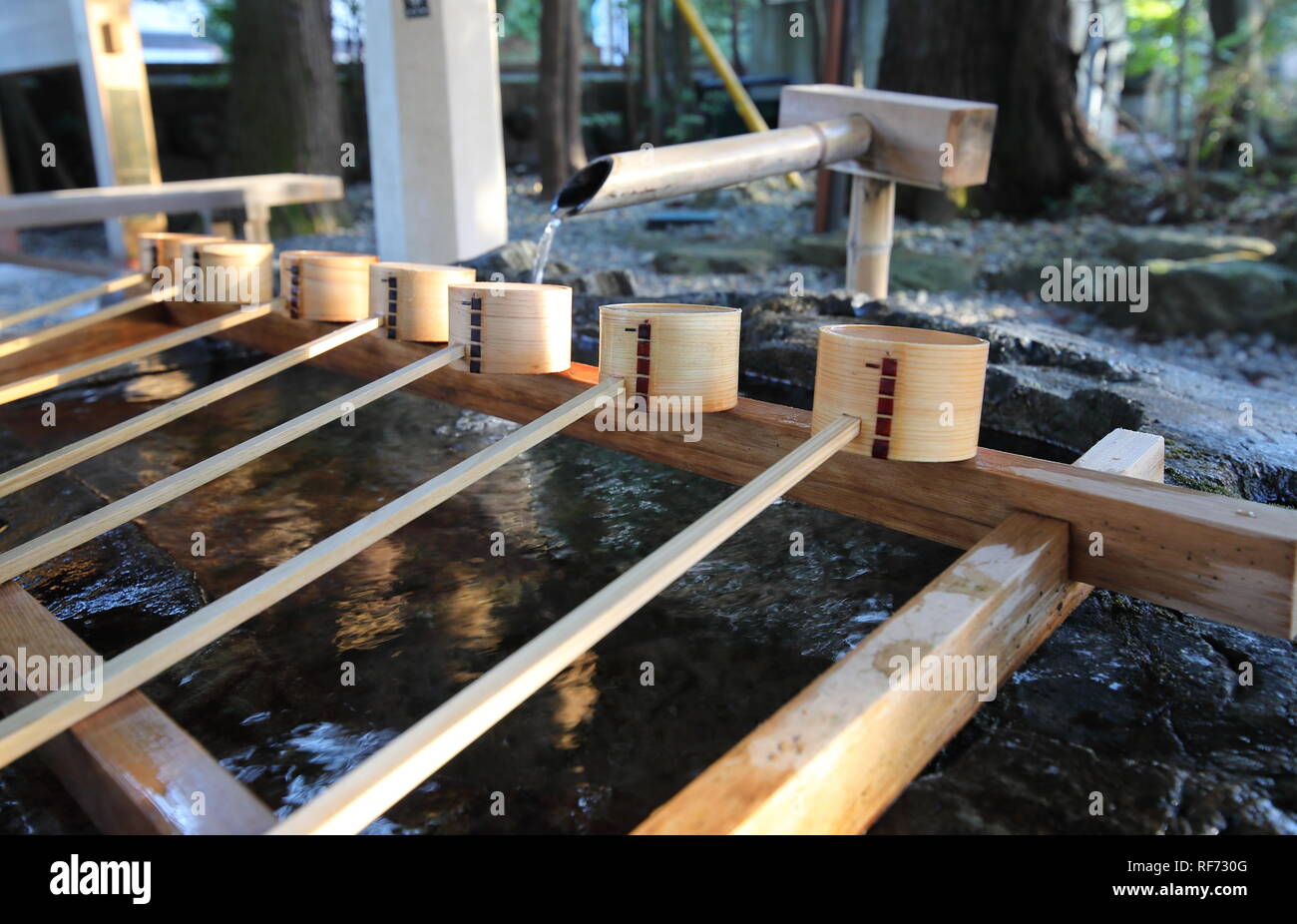 Wooden ladle and holy water well Japanese shrine temple Stock Photo - Alamy