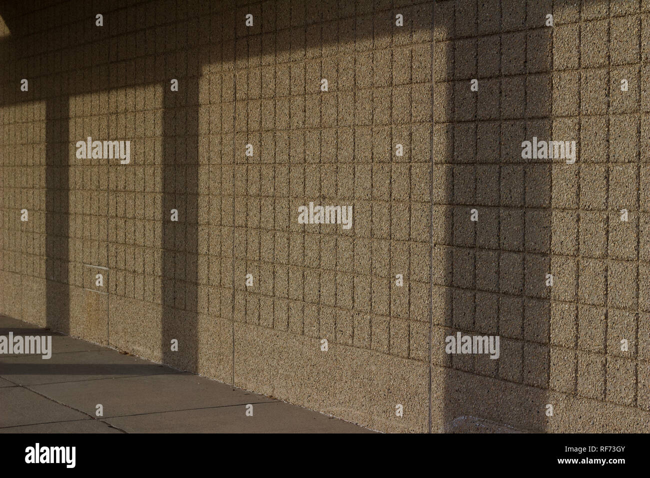 Conglomerate stone look is featured in this beige color square brick ...