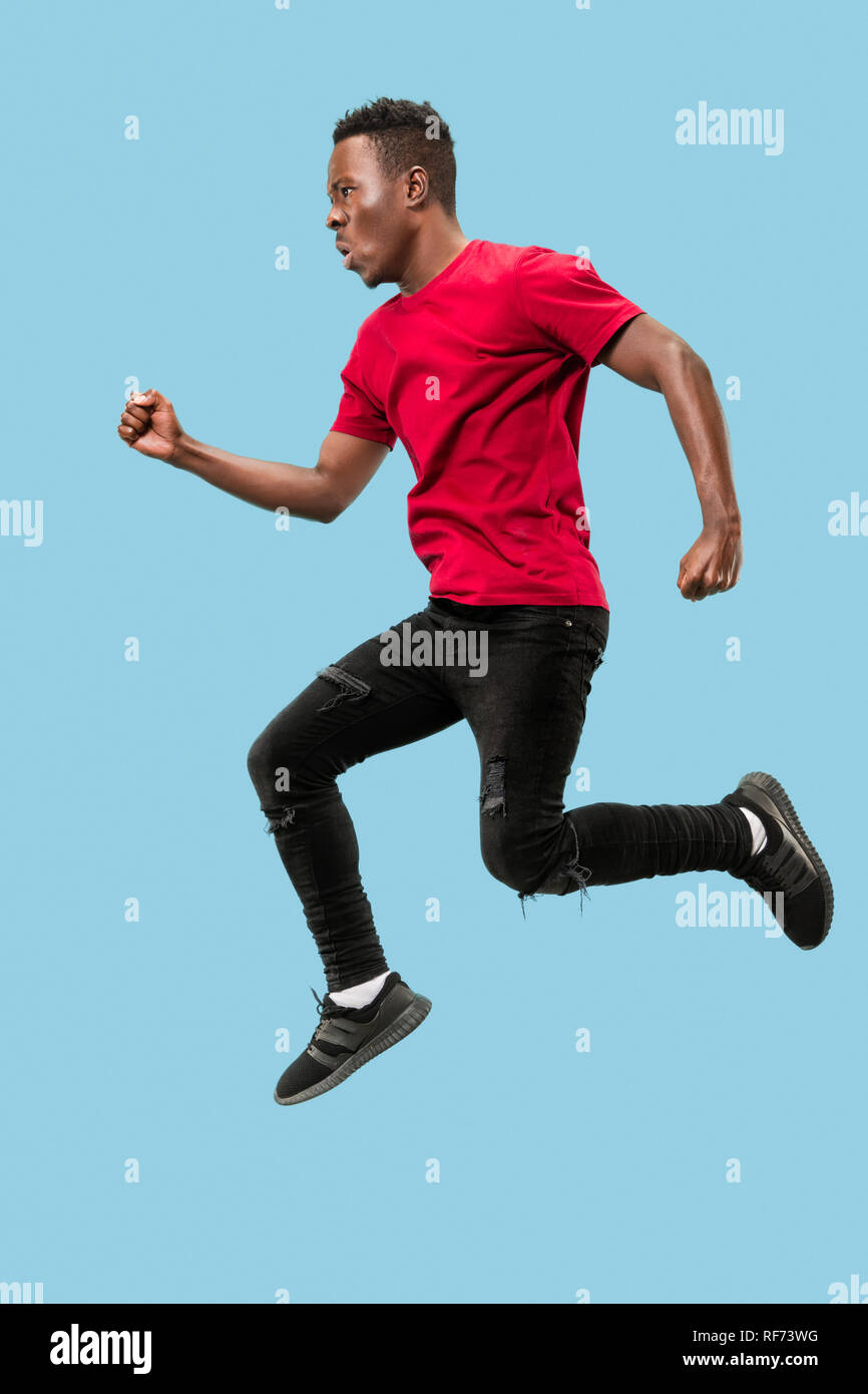 Freedom in moving and forward motion. The happy surprised young african ...