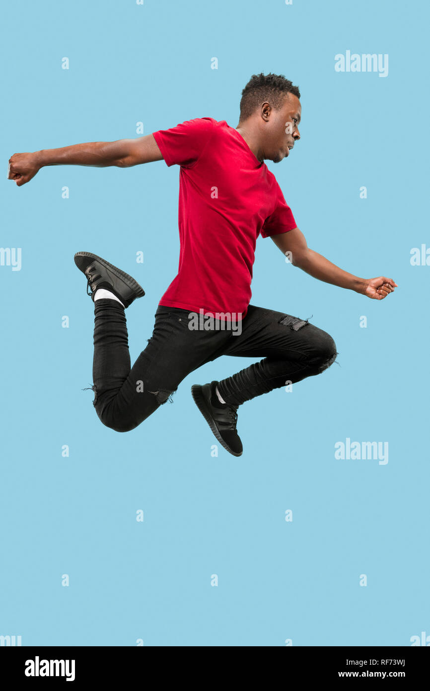 Freedom in moving and forward motion. The happy surprised young african ...