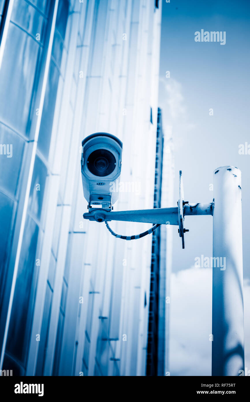 low angle shot on security camera with office building background ...