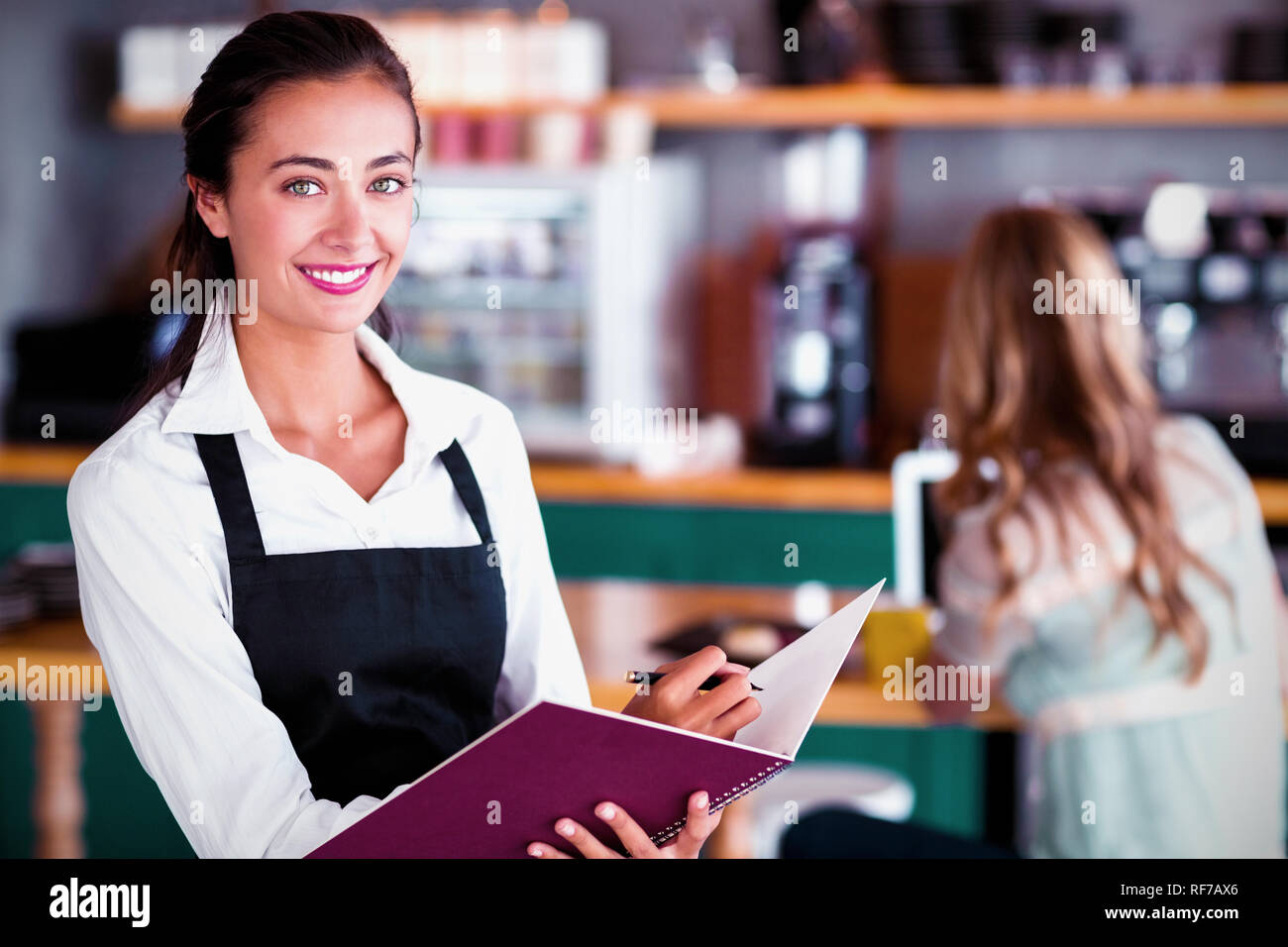 Portrait confident waitress standing counter hi-res stock photography ...
