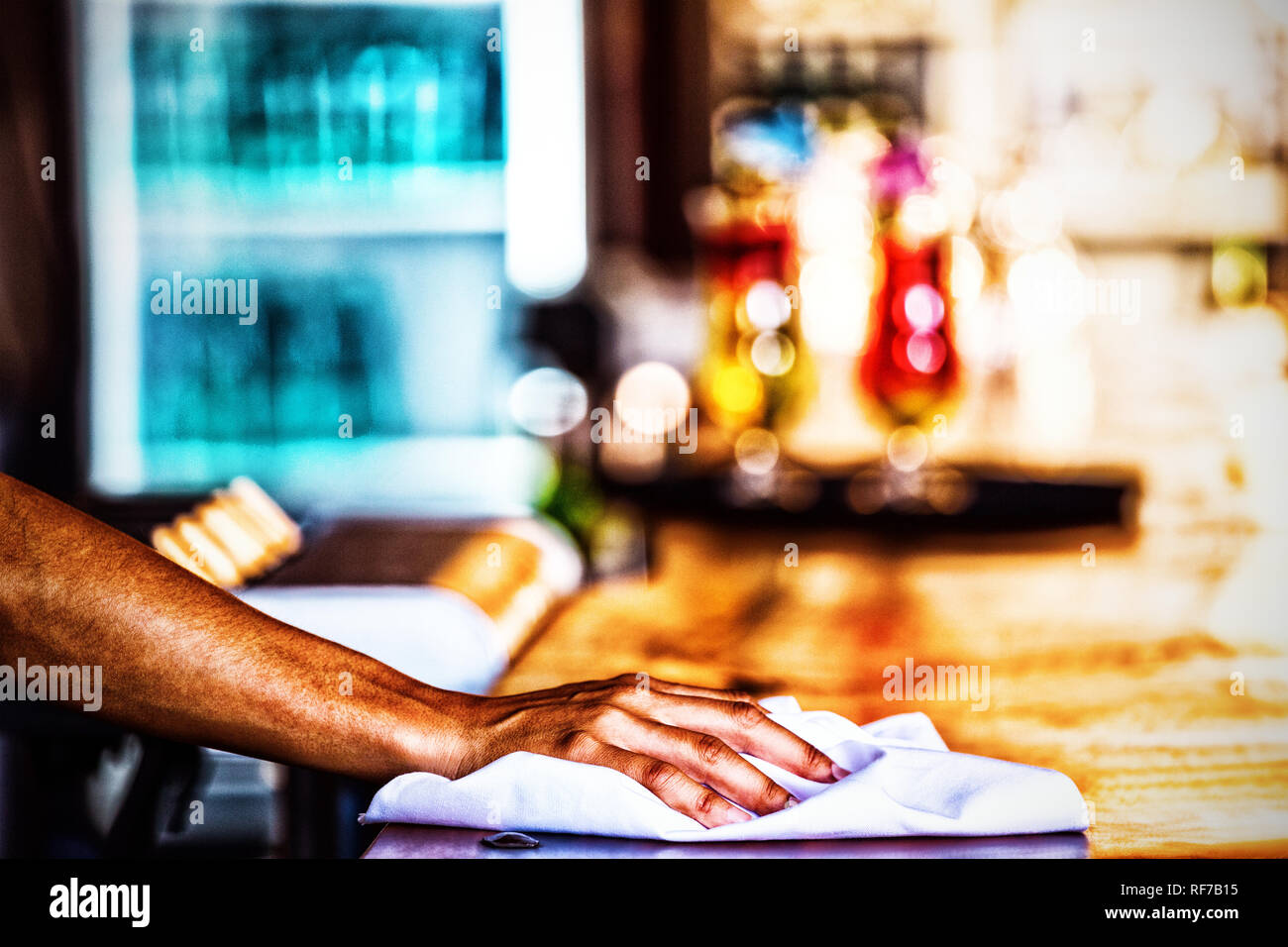 Waitress cleaning the counter in a restaurant Stock Photo - Alamy
