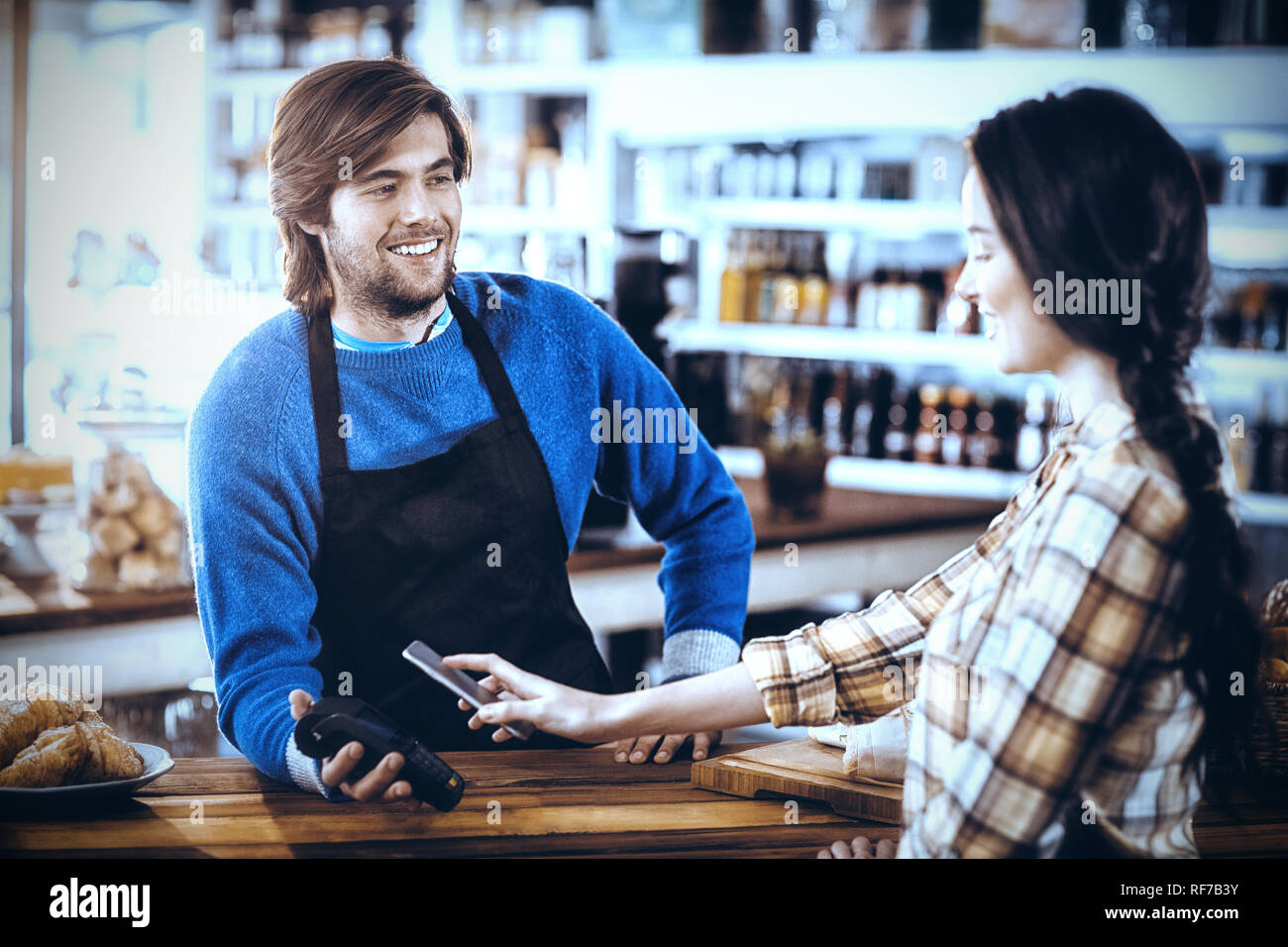 Woman smiling paying using hi-res stock photography and images - Alamy