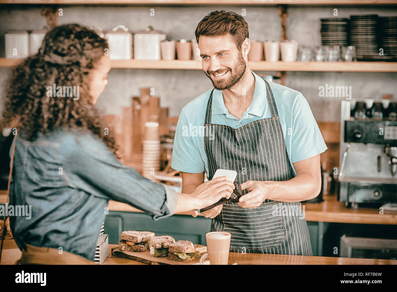 Woman pay bill restaurant hi-res stock photography and images - Alamy