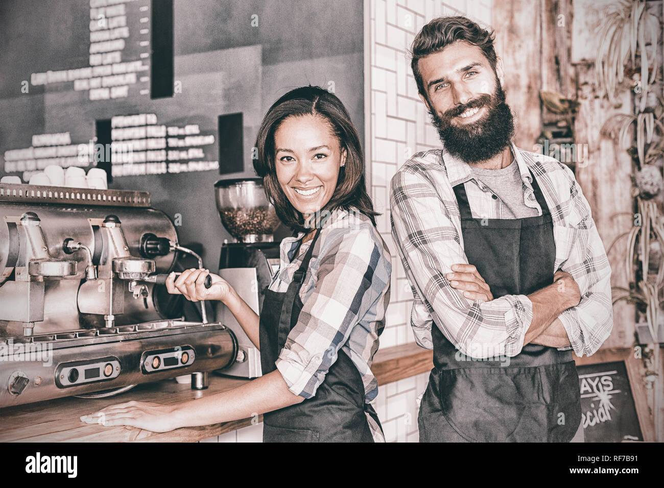 Waiter and waitress standing in kitchen Stock Photo - Alamy