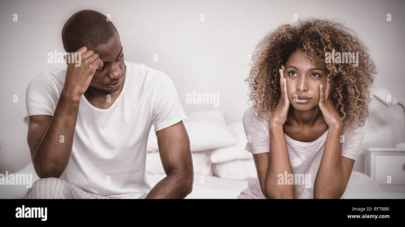 Upset couple ignoring each other after fight on bed Stock Photo - Alamy