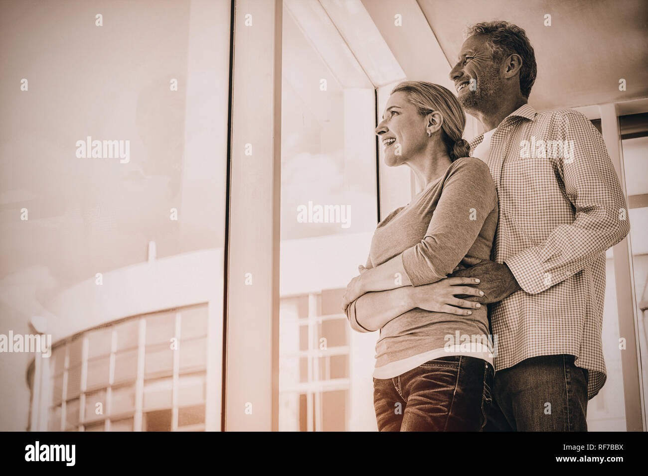 Couple window home hi-res stock photography and images - Alamy
